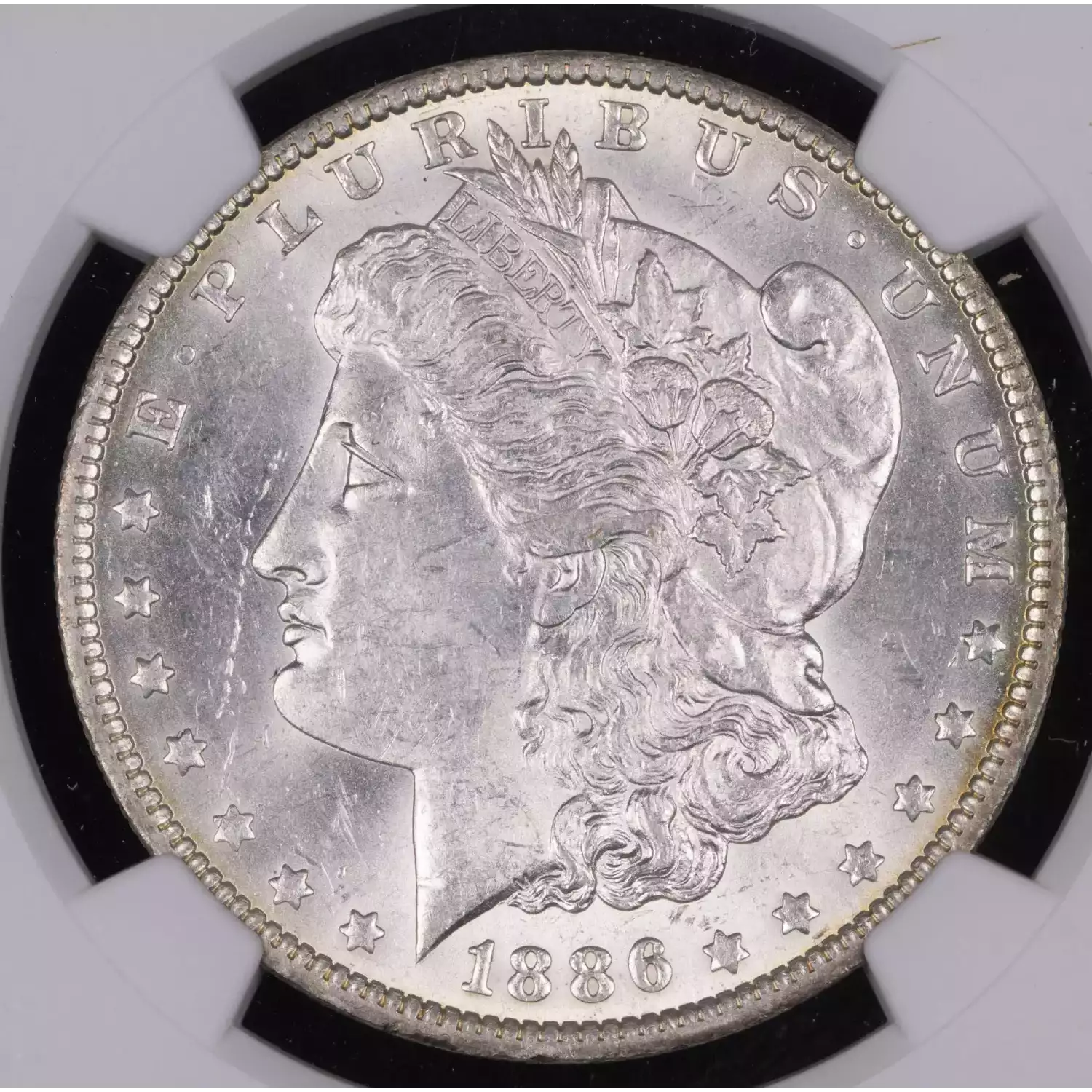 1886-O Morgan Silver Dollar NGC AU-58 - Hertel's Coins Inc.